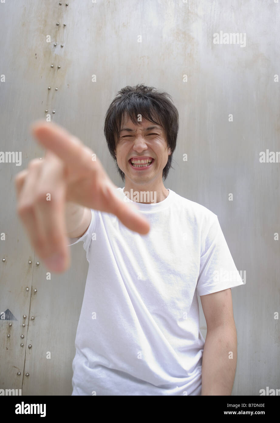 Young man pointing finger Stock Photo - Alamy Young man pointing finger Stock Photo - Alamy