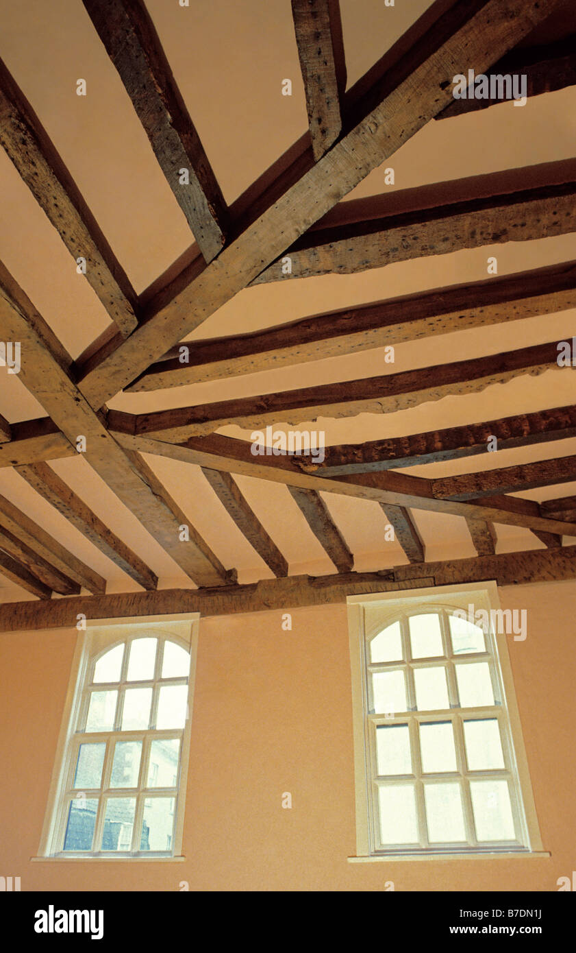 Underside of ceiling beams in old house with mansard roof after lining ...