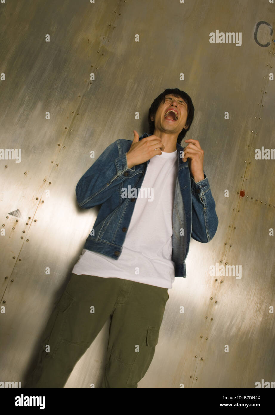 Young man shouting Stock Photo - Alamy