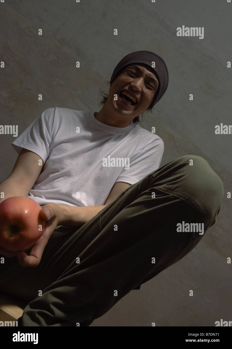 Man holding apple Stock Photo - Alamy
