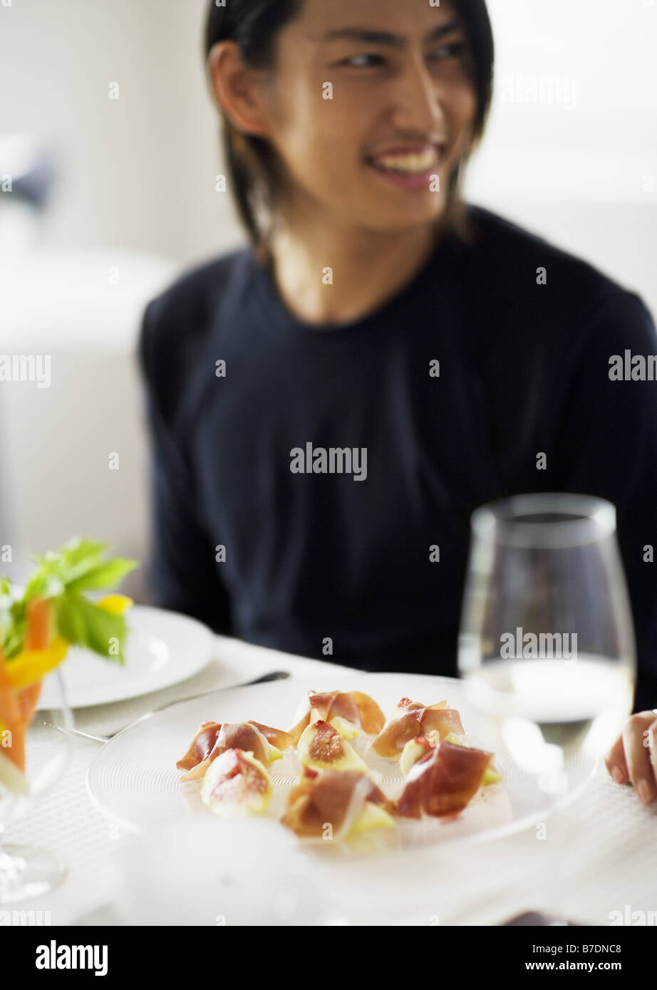 Man at dining table Stock Photo - Alamy