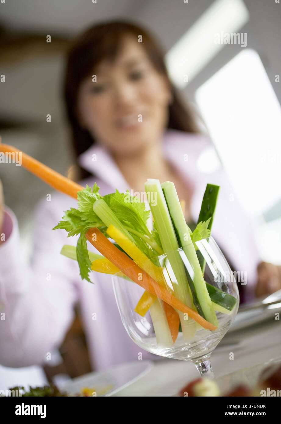 Veggie sticks and a woman Stock Photo - Alamy