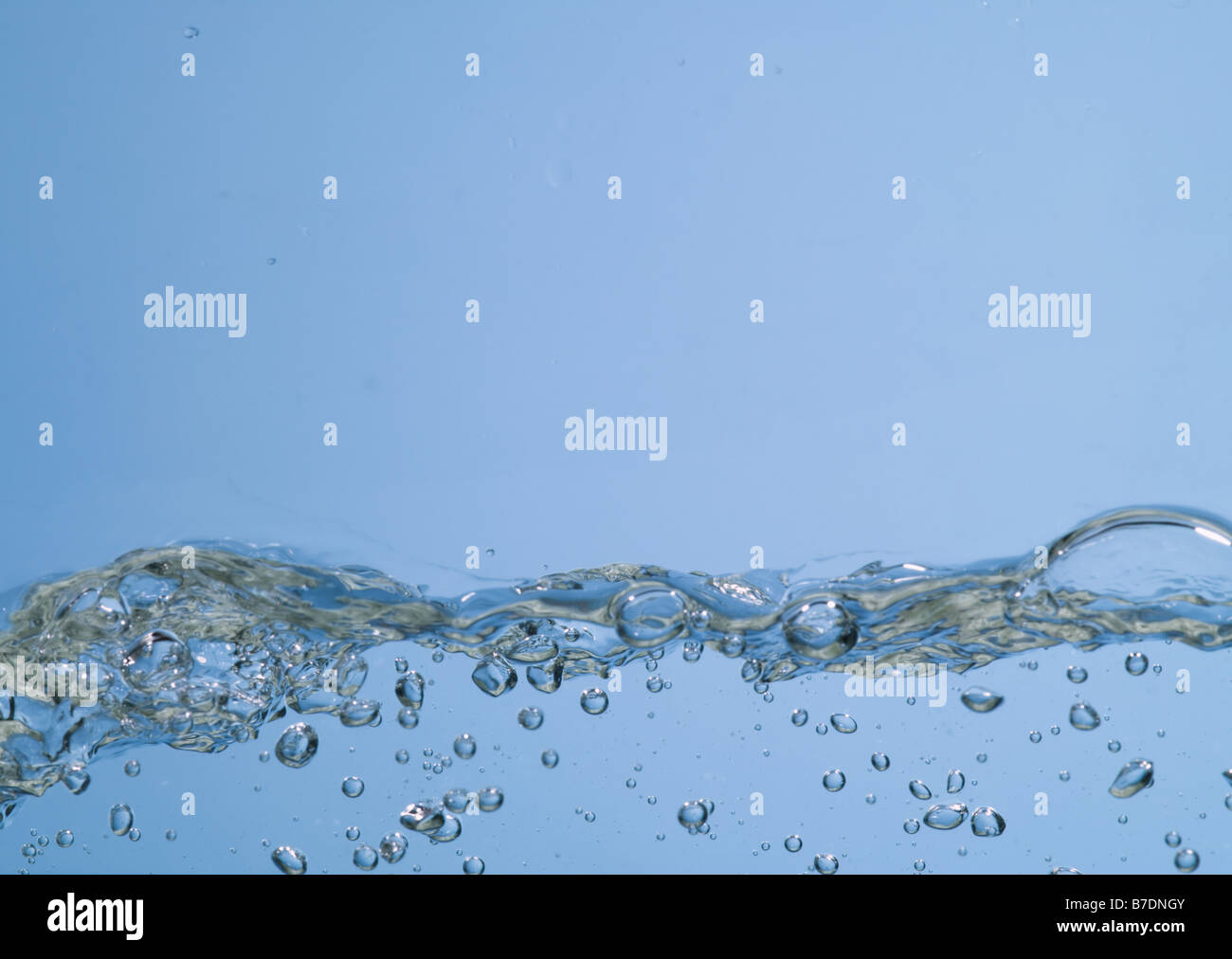 Wave motion and water bubbles Stock Photo - Alamy