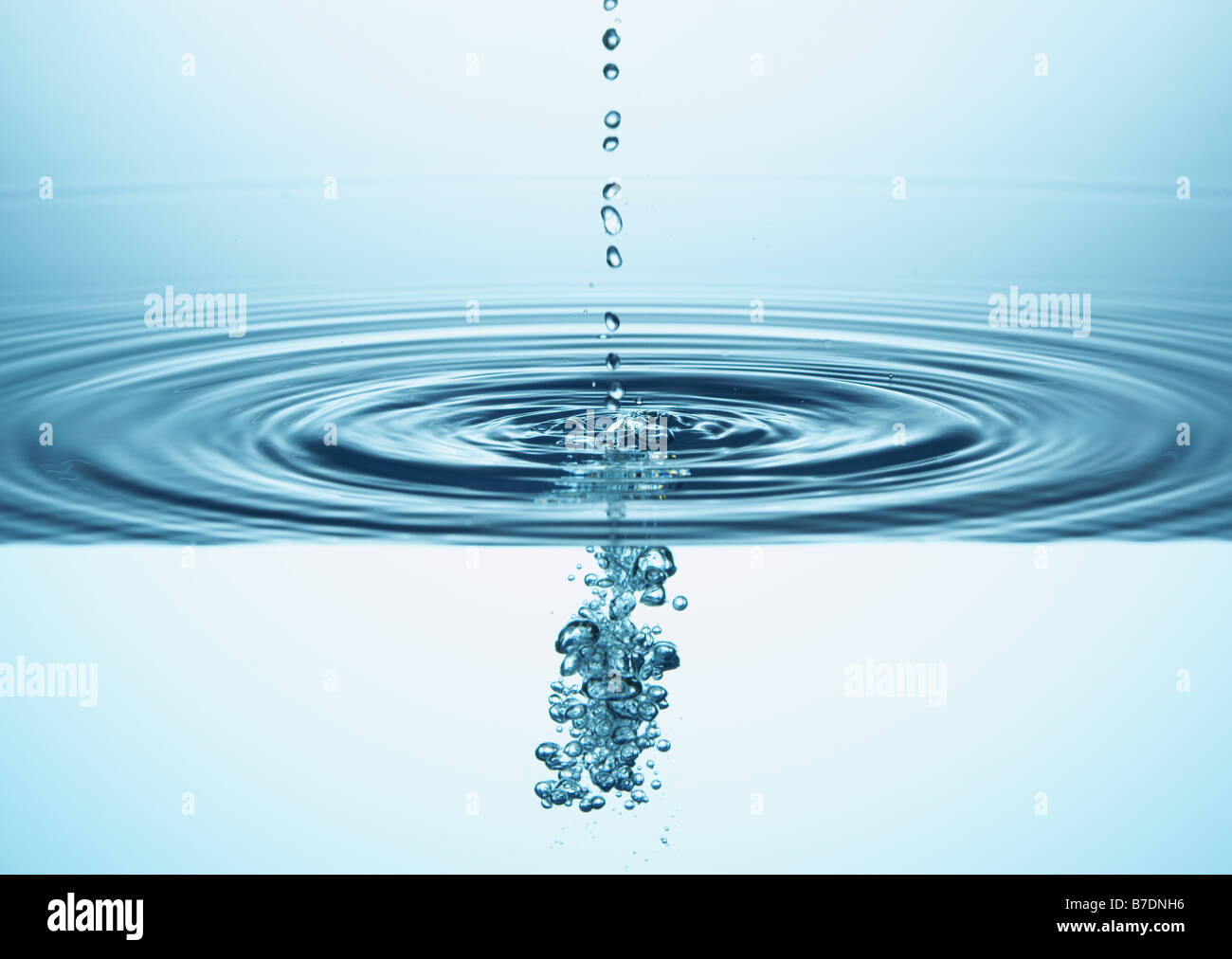 Ripple and water drops Stock Photo - Alamy