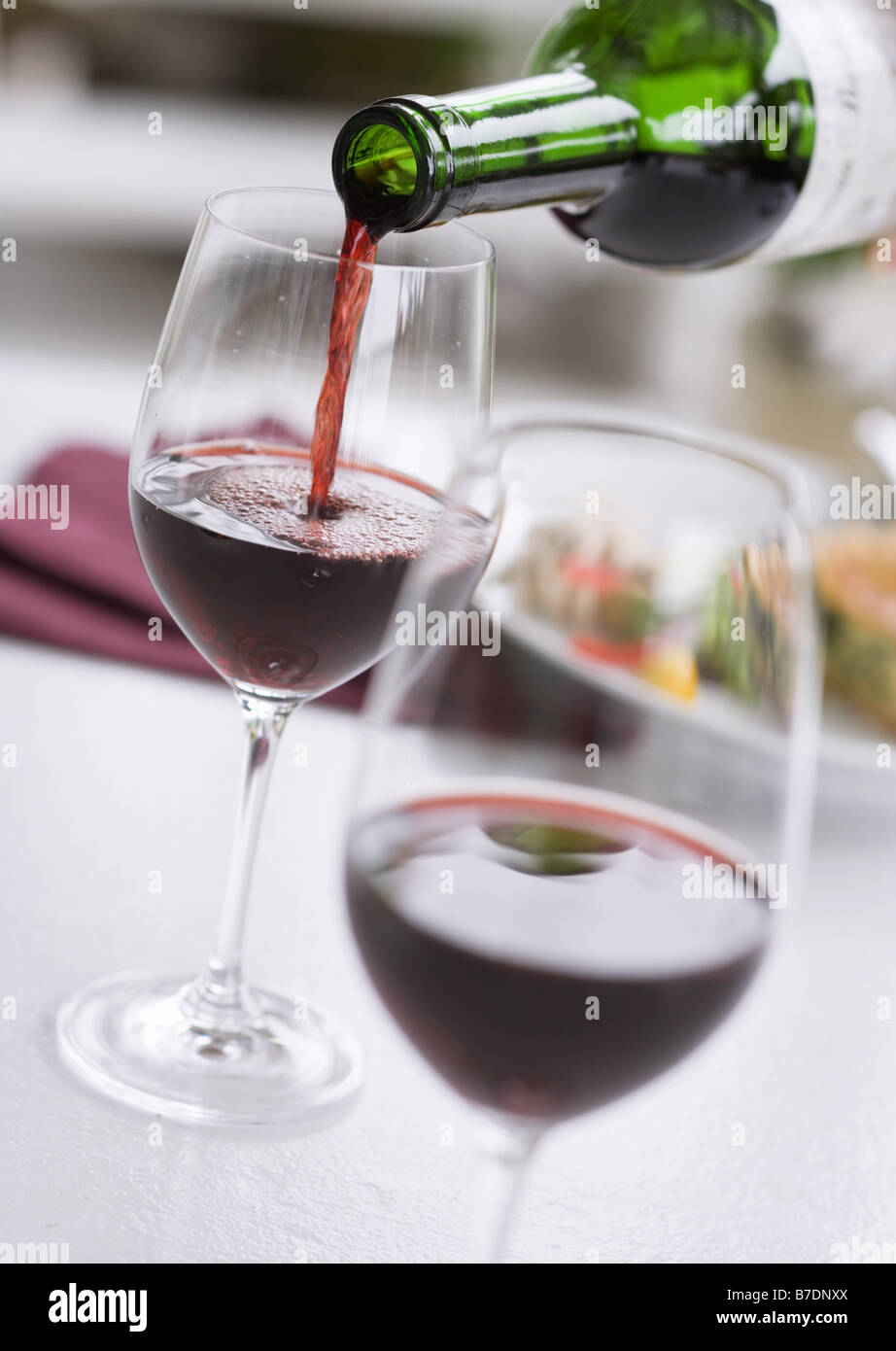Pouring red wine Stock Photo - Alamy