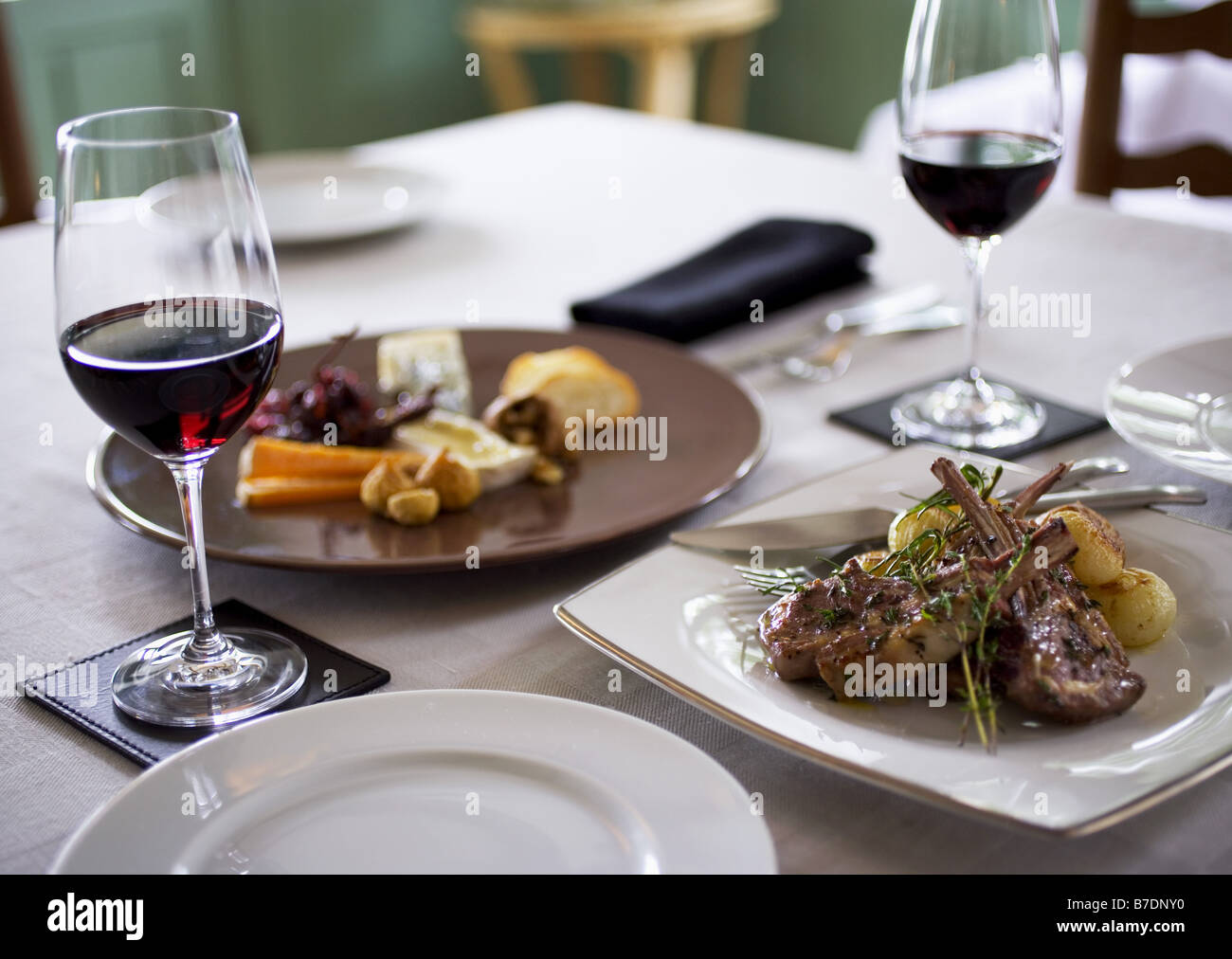 Dining table with red wine Stock Photo - Alamy