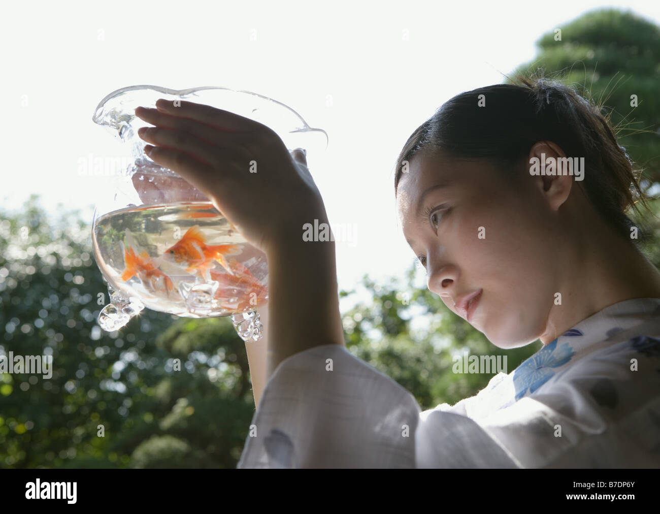Woman wearing Yukata and fishbowl Stock Photo - Alamy