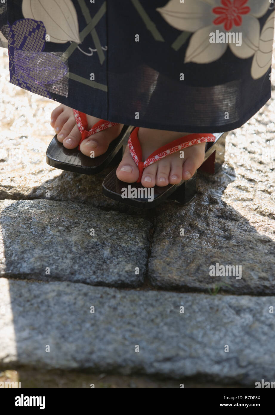 Feet with Japanese wooden clogs Stock Photo - Alamy