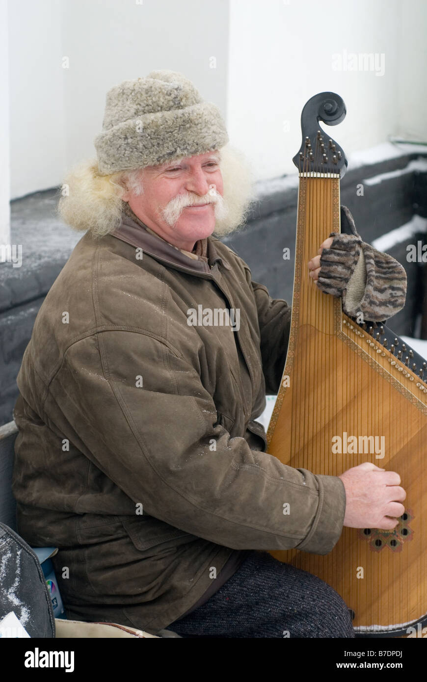 Male musician playing bandura hi-res stock photography and images - Alamy