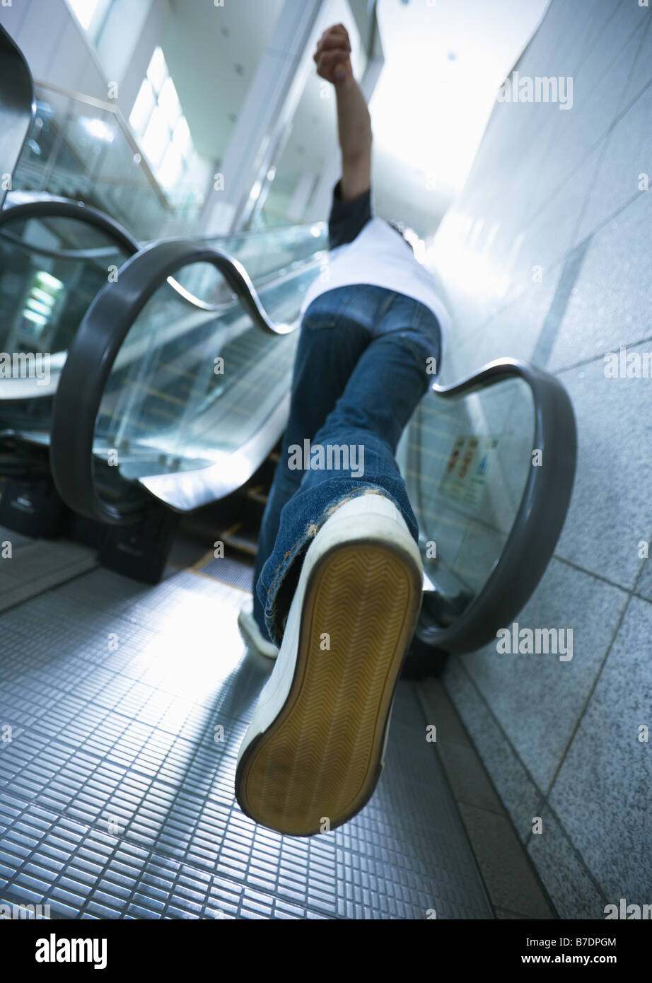 Young man running up escalator Stock Photo - Alamy Young man running up escalator Stock Photo - Alamy