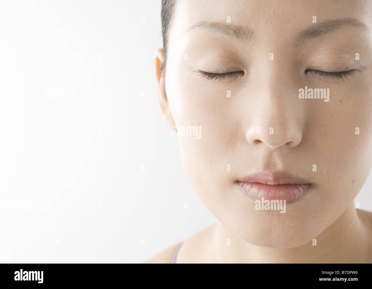 Woman with eyes closed Stock Photo - Alamy