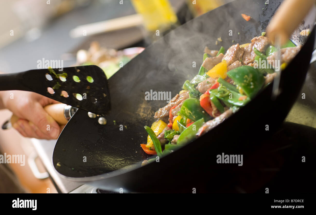 Wok cooking hi-res stock photography and images - Alamy