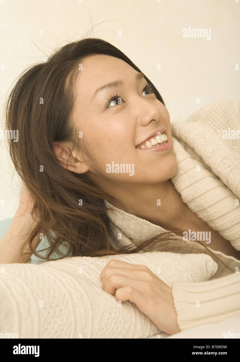 Relaxed young woman looking up Stock Photo - Alamy