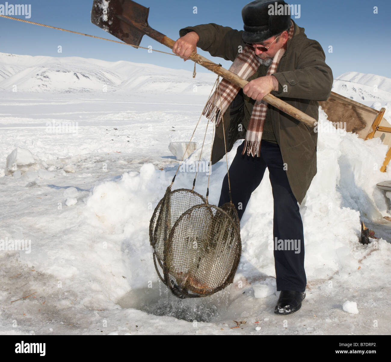 Ice fishing for Crabs with nets, Amguema, Chukotka, Siberia Russia ...