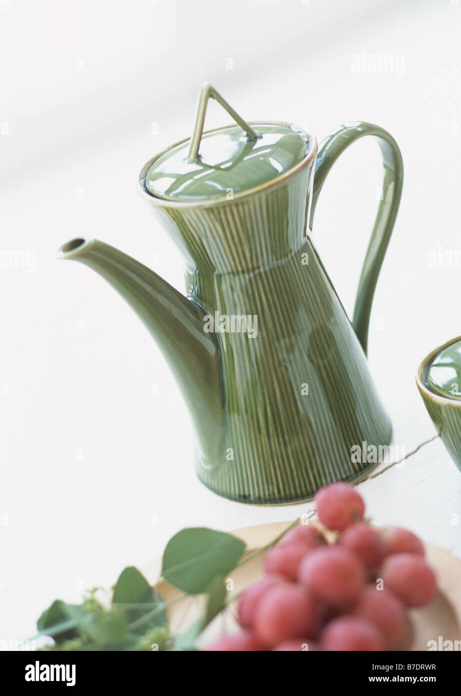 Green ceramic pot and grapes Stock Photo - Alamy