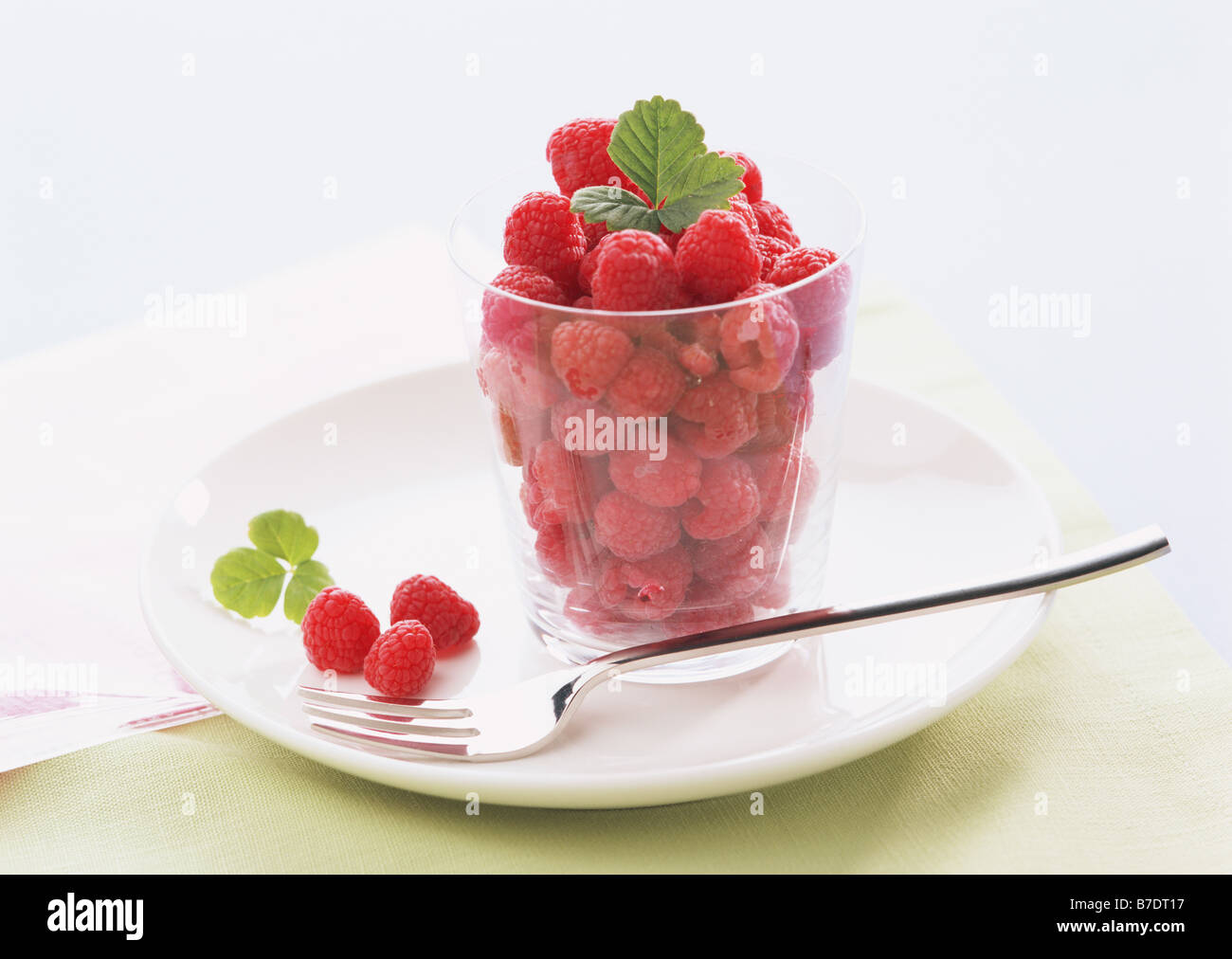 Raspberries in glass bowl Stock Photo - Alamy