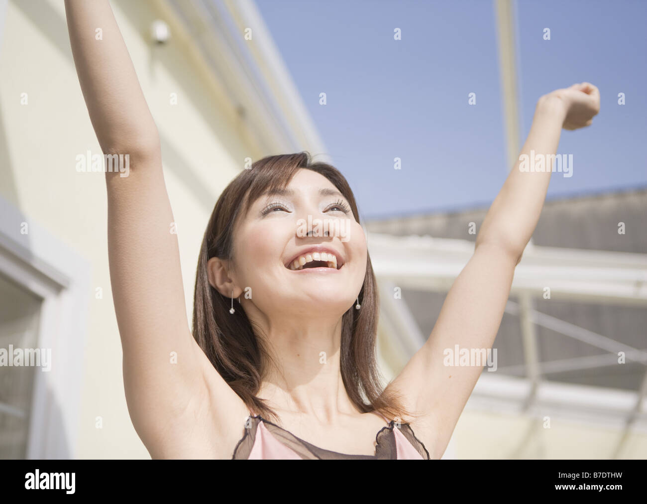 Woman stretching arms Stock Photo - Alamy