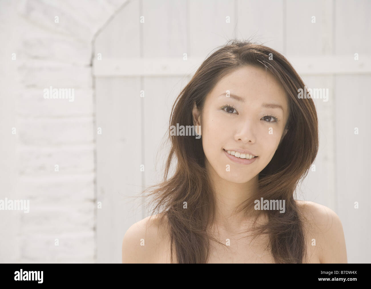 Smiling woman with long hair Stock Photo - Alamy