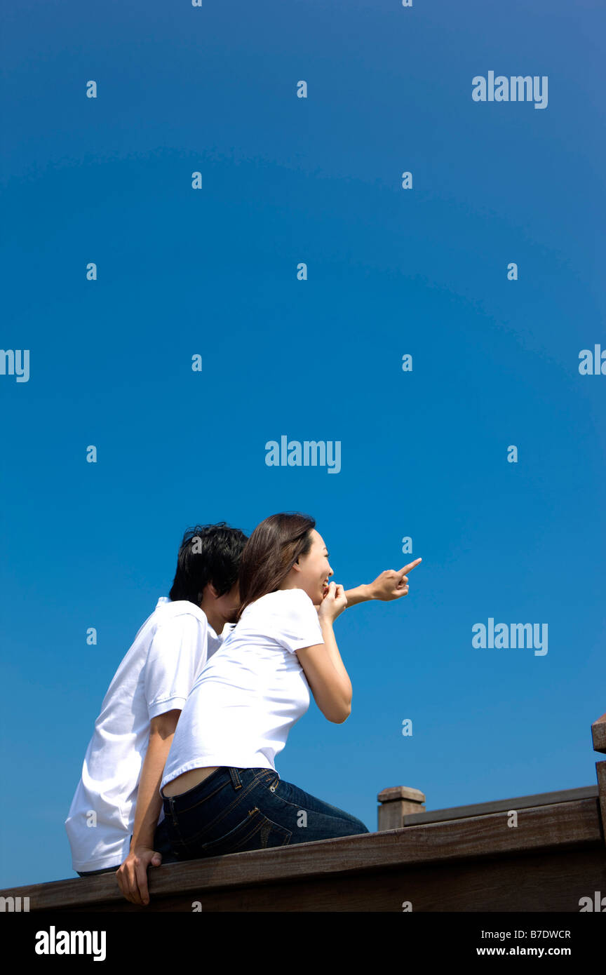 Couple pointing from side hi-res stock photography and images - Alamy