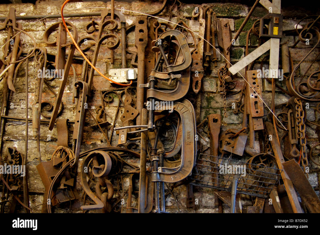 Old tools on a blacksmith s wall Stock Photo - Alamy