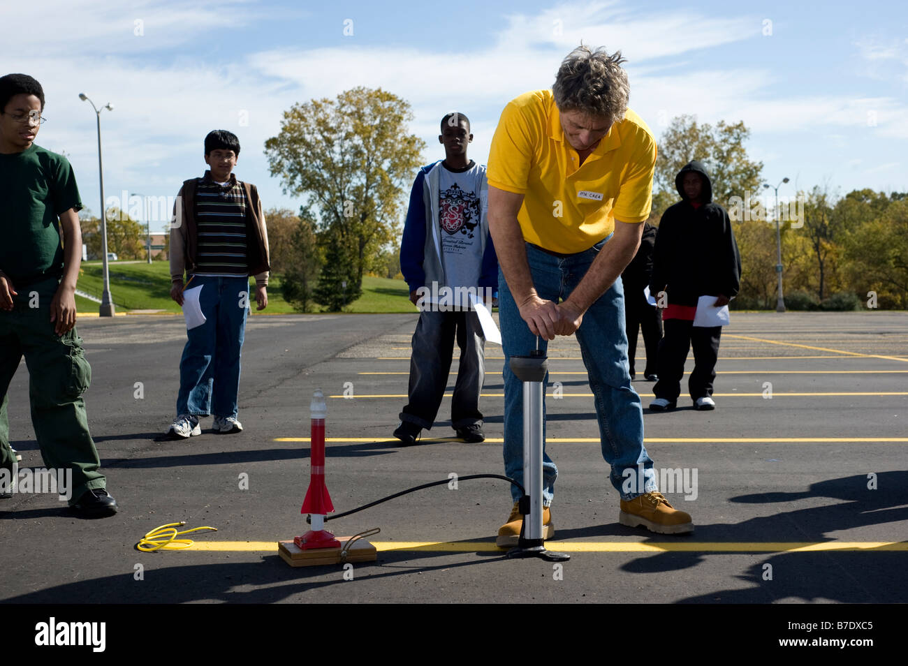 Science teacher pumping up an air-powered rocket Stock Photo - Alamy