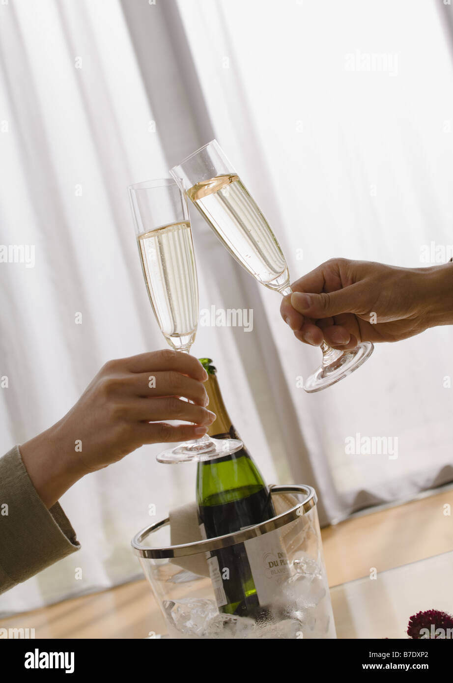 Couple proposing toast Stock Photo - Alamy
