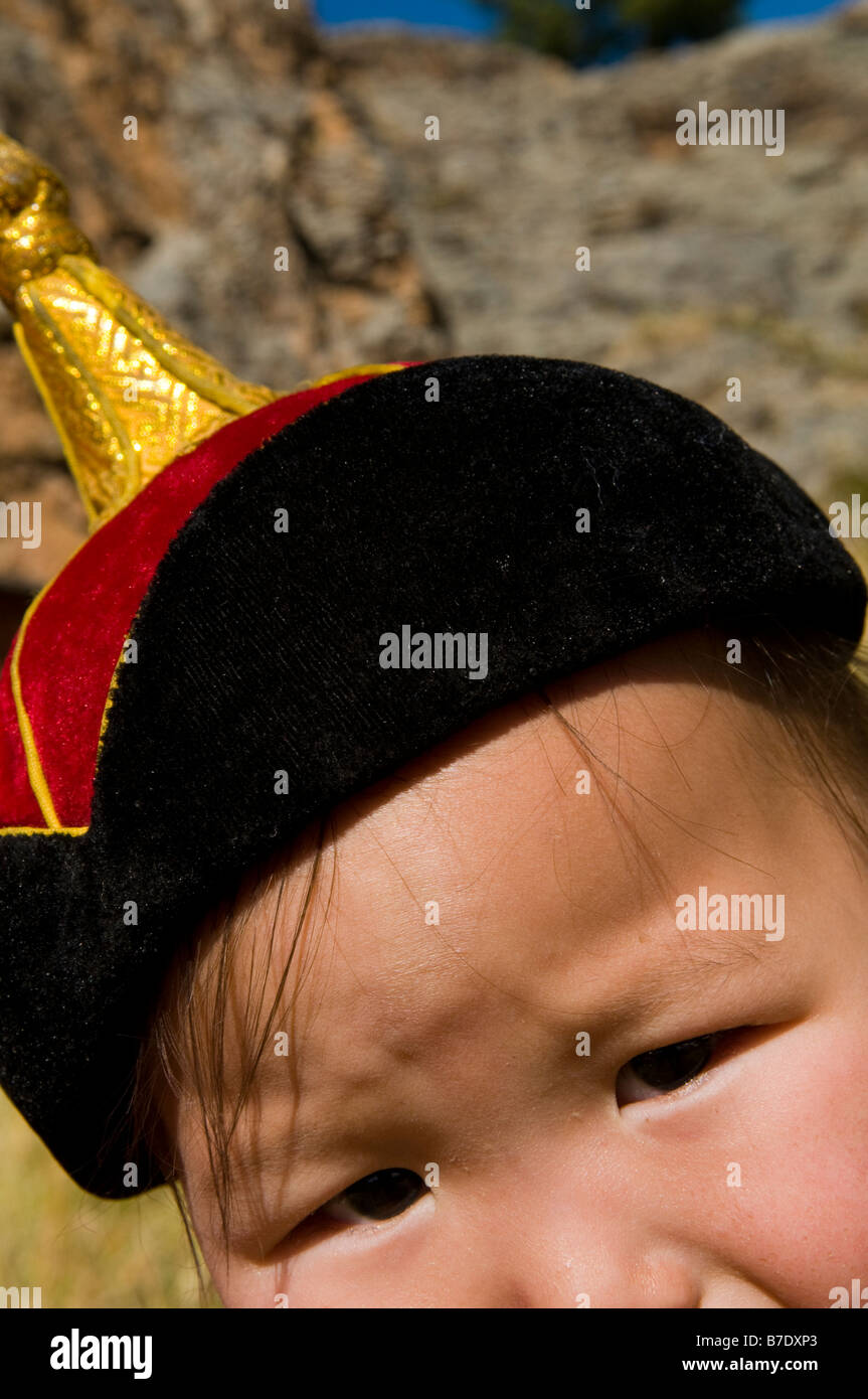 Cute Mongolian boy wears a traditional hat Stock Photo - Alamy