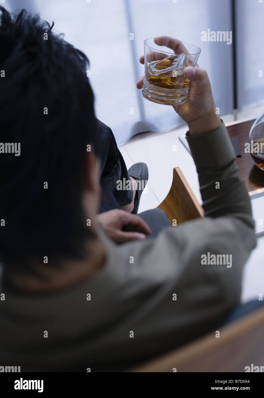 Man enjoying drinking brandy Stock Photo - Alamy