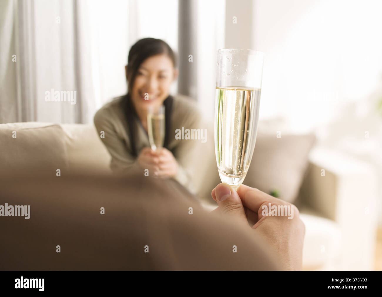 Woman drinking champagne Stock Photo - Alamy