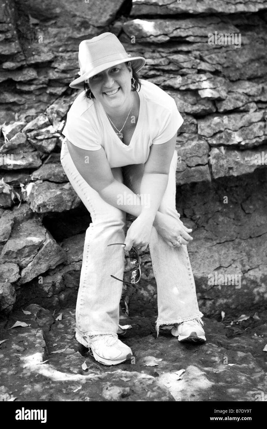 A woman taking a break, smiles for a photo Stock Photo - Alamy
