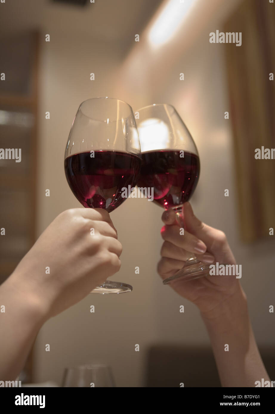 Toasting with wine Stock Photo - Alamy