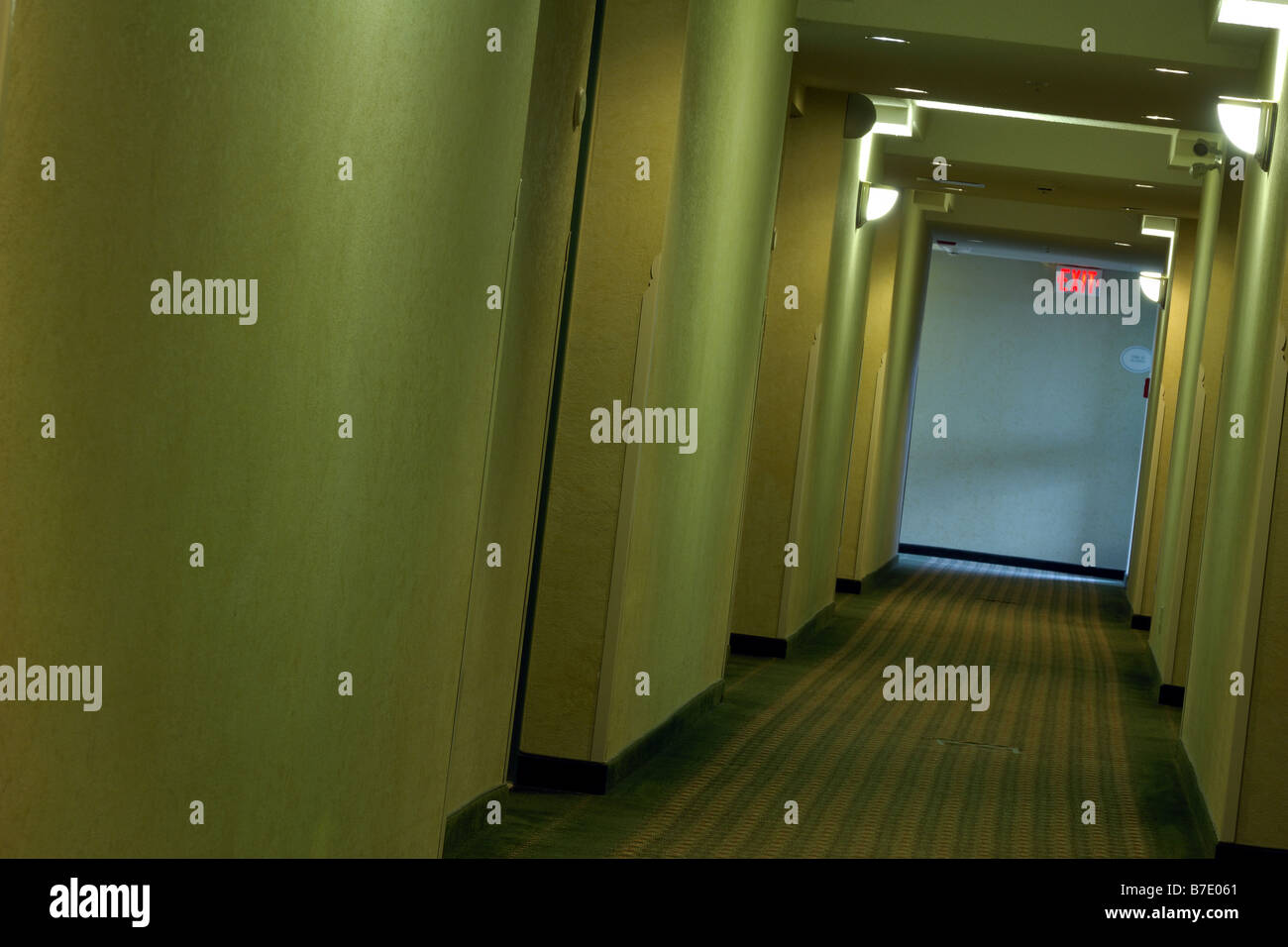 Corridor with exit sign in a hotel hi-res stock photography and images ...