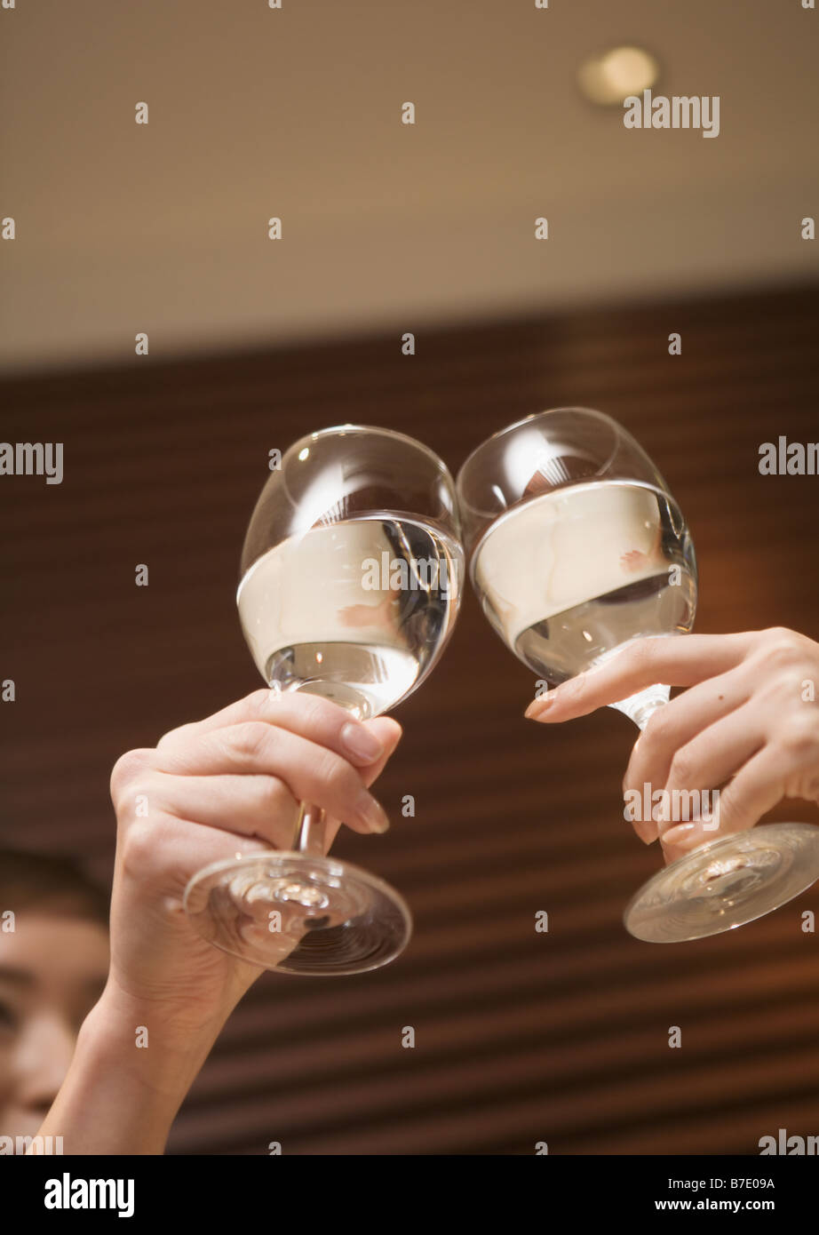 Toasting with wine Stock Photo - Alamy