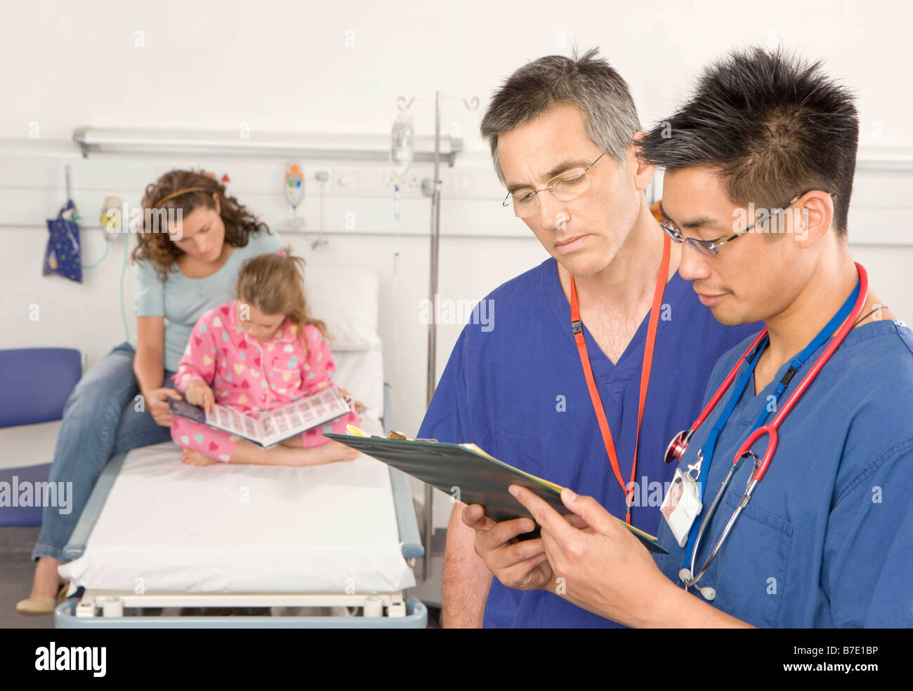 Two doctors check a patient notes Stock Photo - Alamy