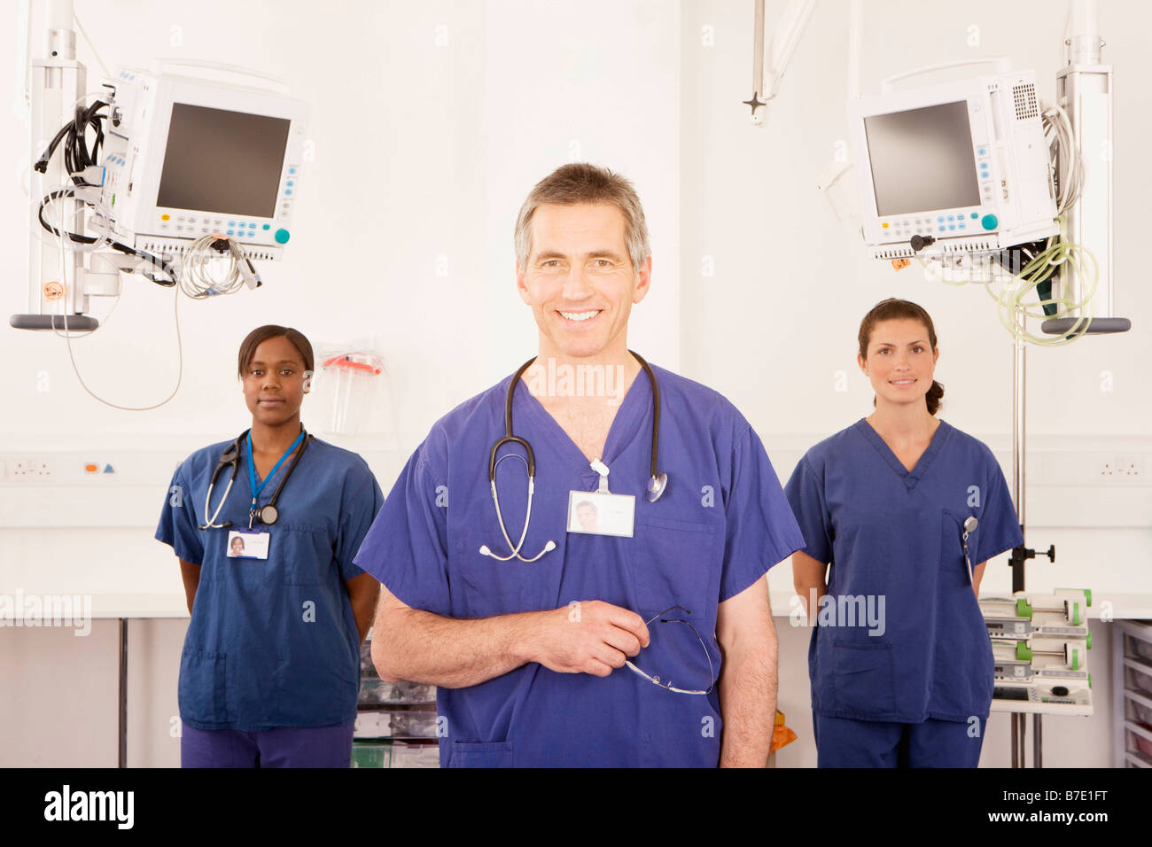 A portrait of three doctors smiling Stock Photo - Alamy