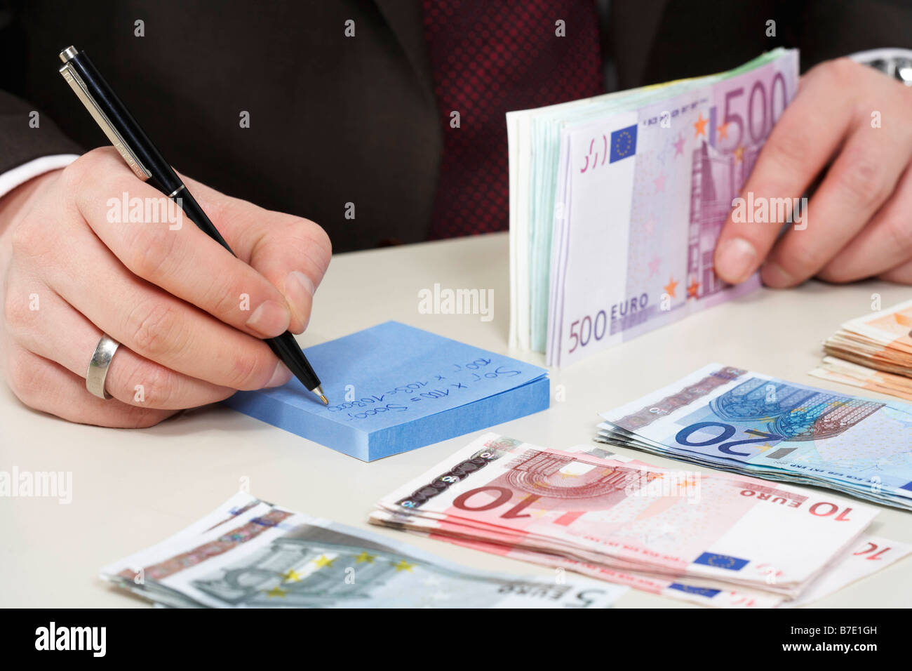 Money on desk Stock Photo - Alamy