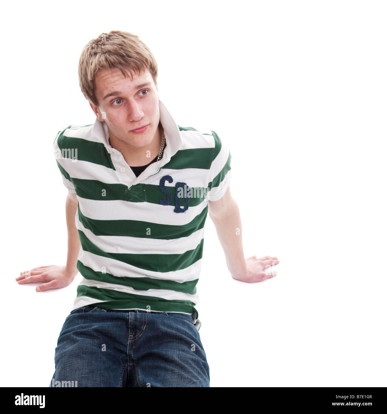 Teenage Lad Leaning Back On Outstretched Arms Looking Into Distance ...