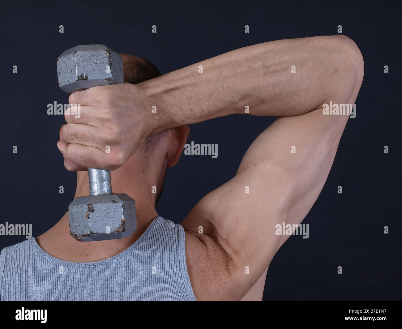 Male bodybuilder with arms behind his head hi-res stock photography and ...