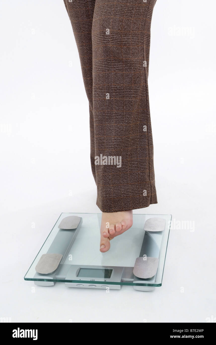 woman on a scale Stock Photo - Alamy