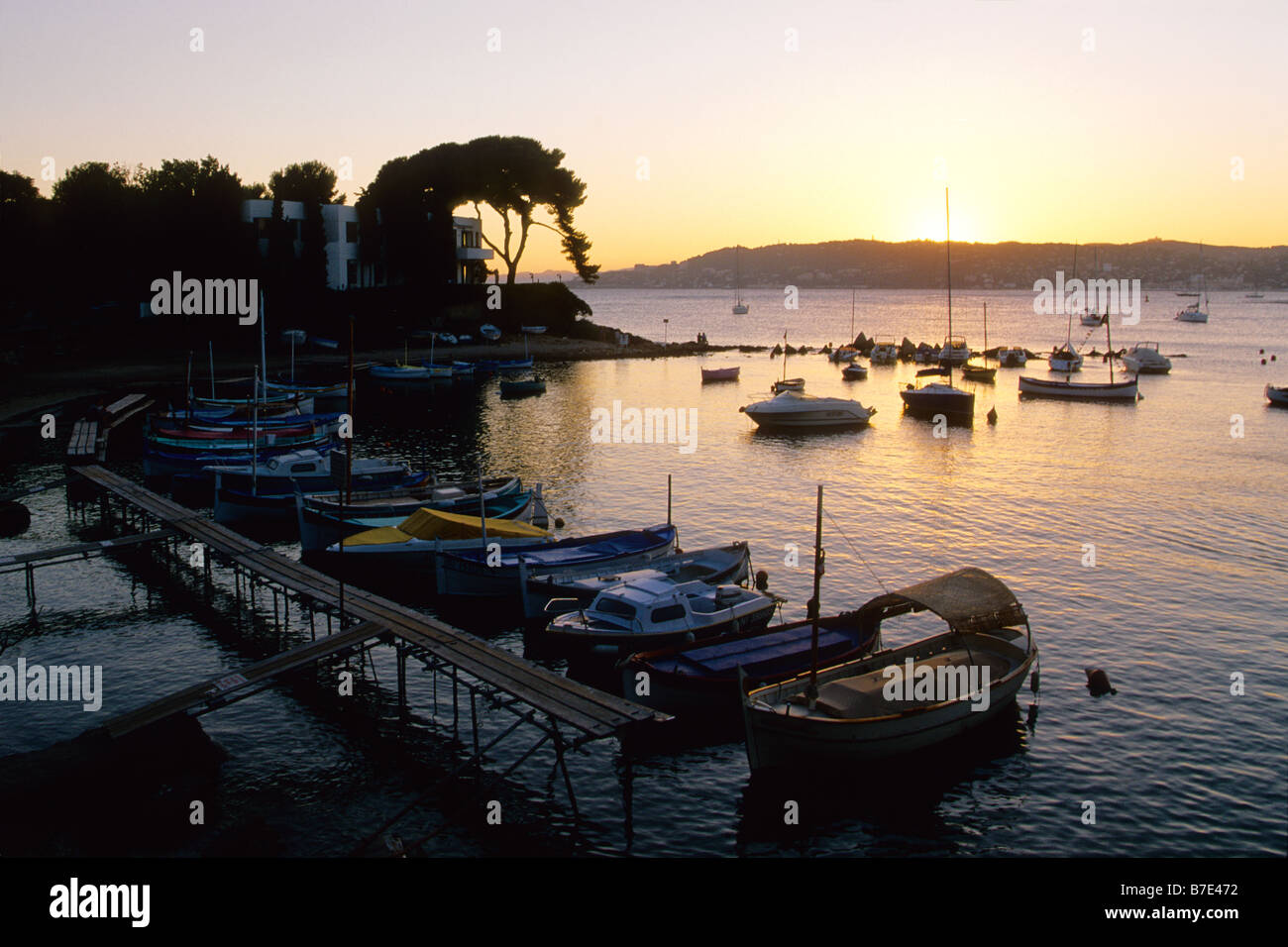 Sunset in the tiny harbour of Olivette Stock Photo - Alamy
