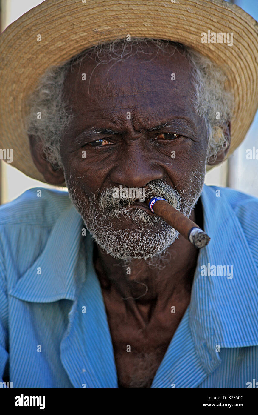 A cuban man smoking a cigar, Trinidad, Cuba island, West Indies ...