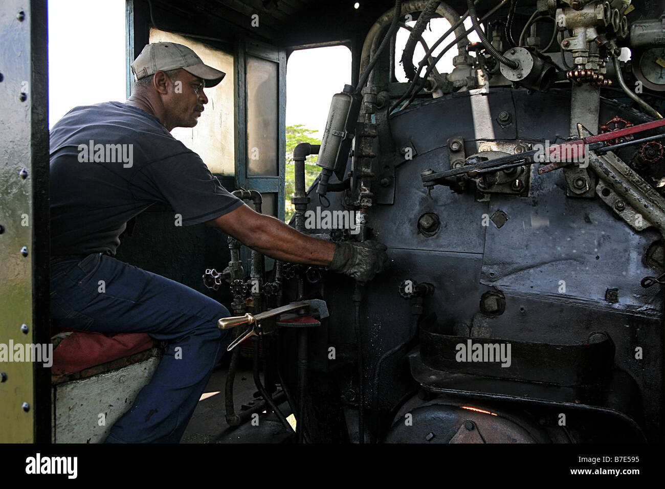 Engine-driver of steam locomotive, Havana, Cuba island, West Indies ...