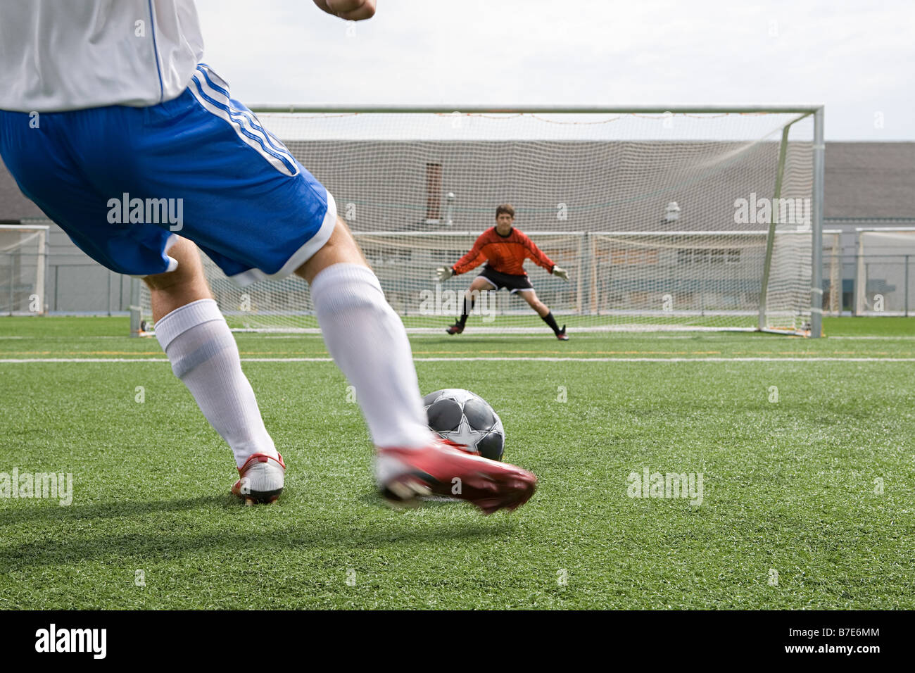Footballer and goalkeeper Stock Photo - Alamy