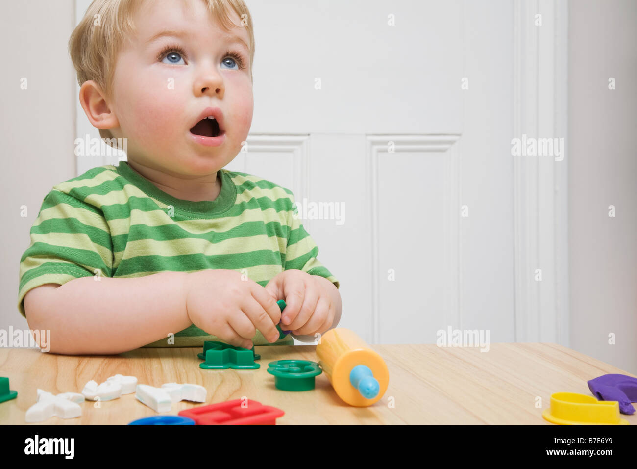 Little boy with toys Stock Photo - Alamy