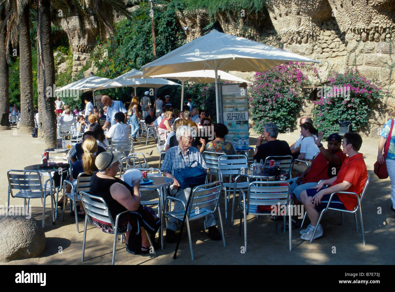 Parc Guell People at outdoor cafe Tables chairs Umbrellas BARCELONA ...