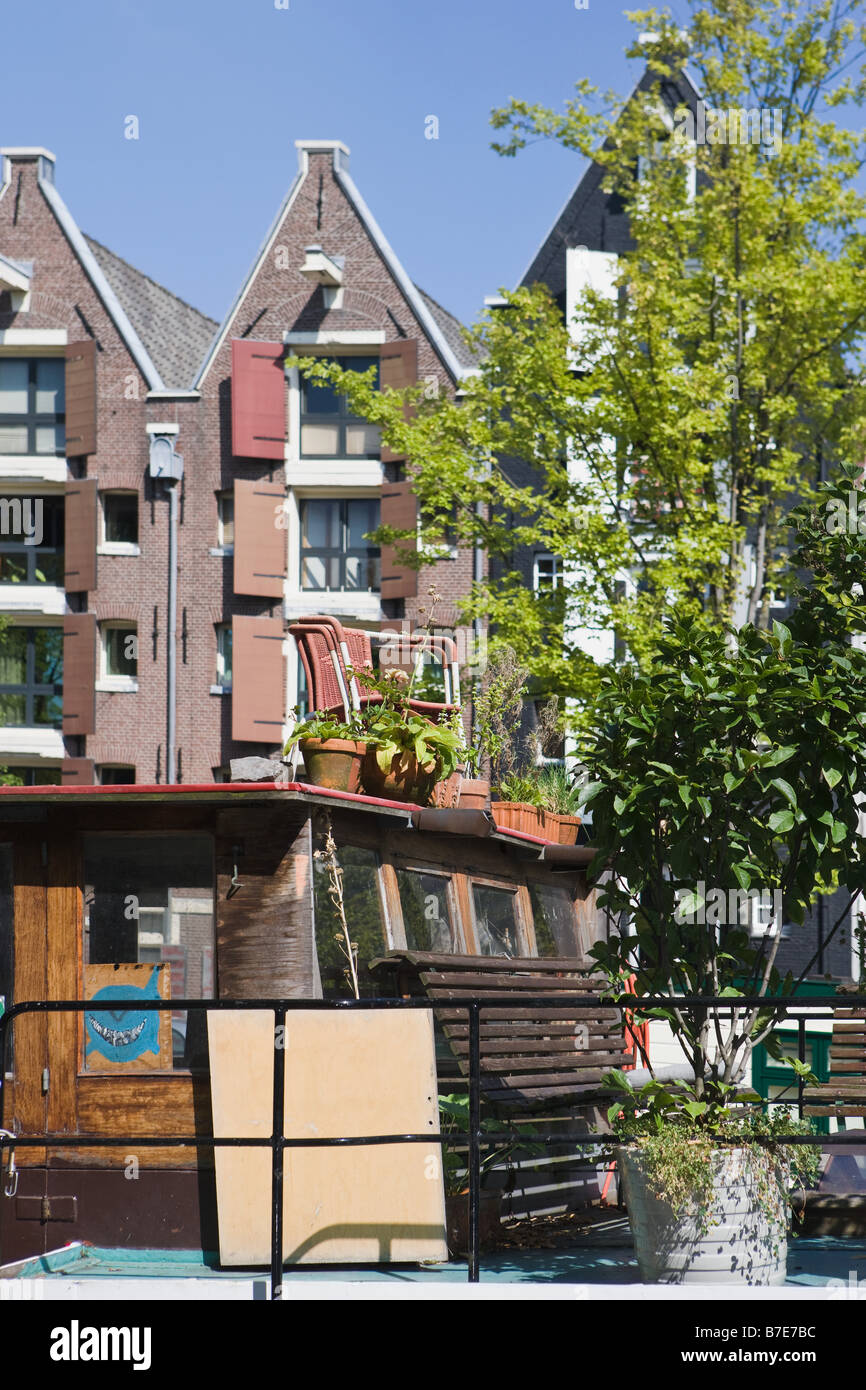 Building and boat in amsterdam Stock Photo - Alamy