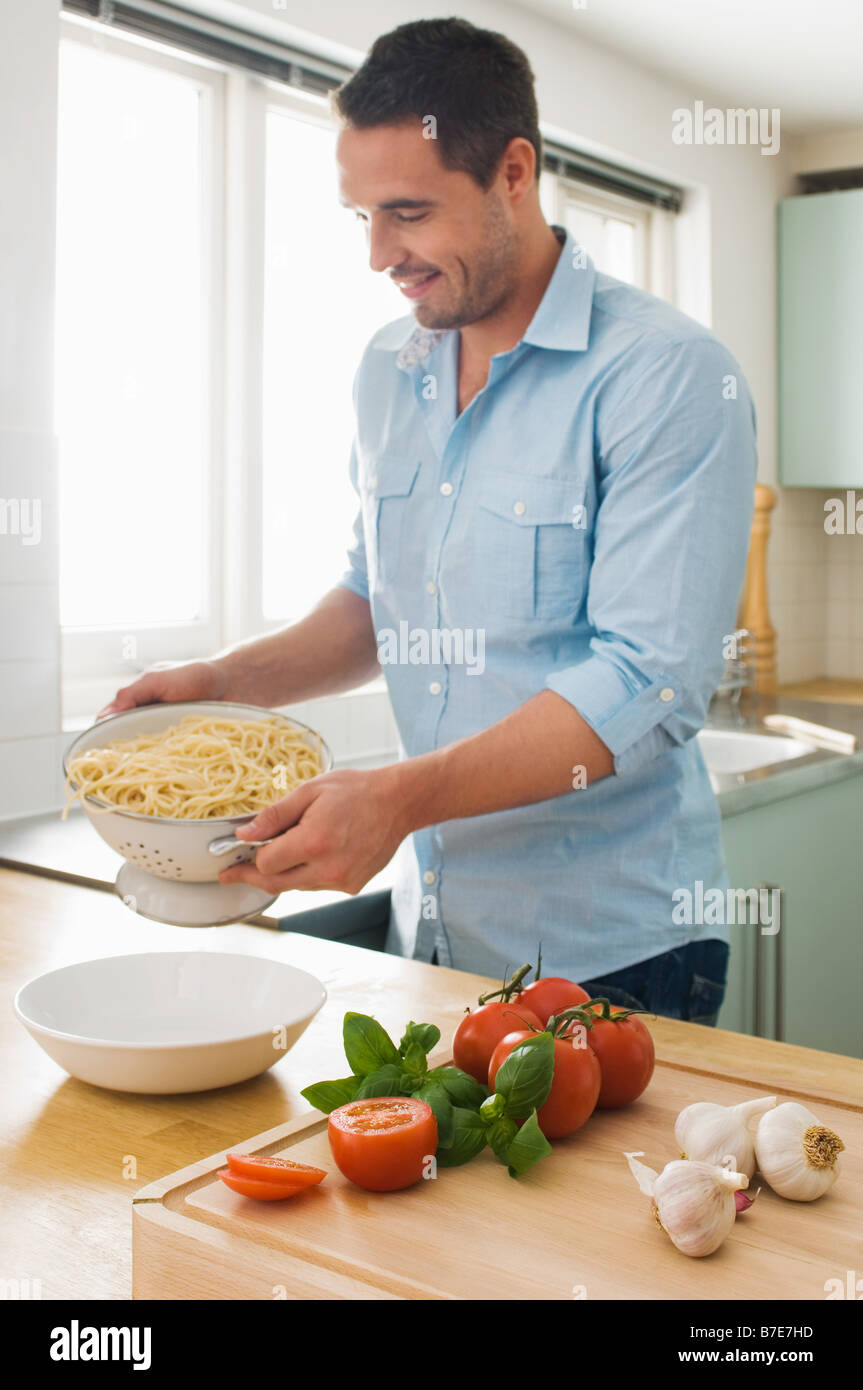 Man making meal Stock Photo - Alamy