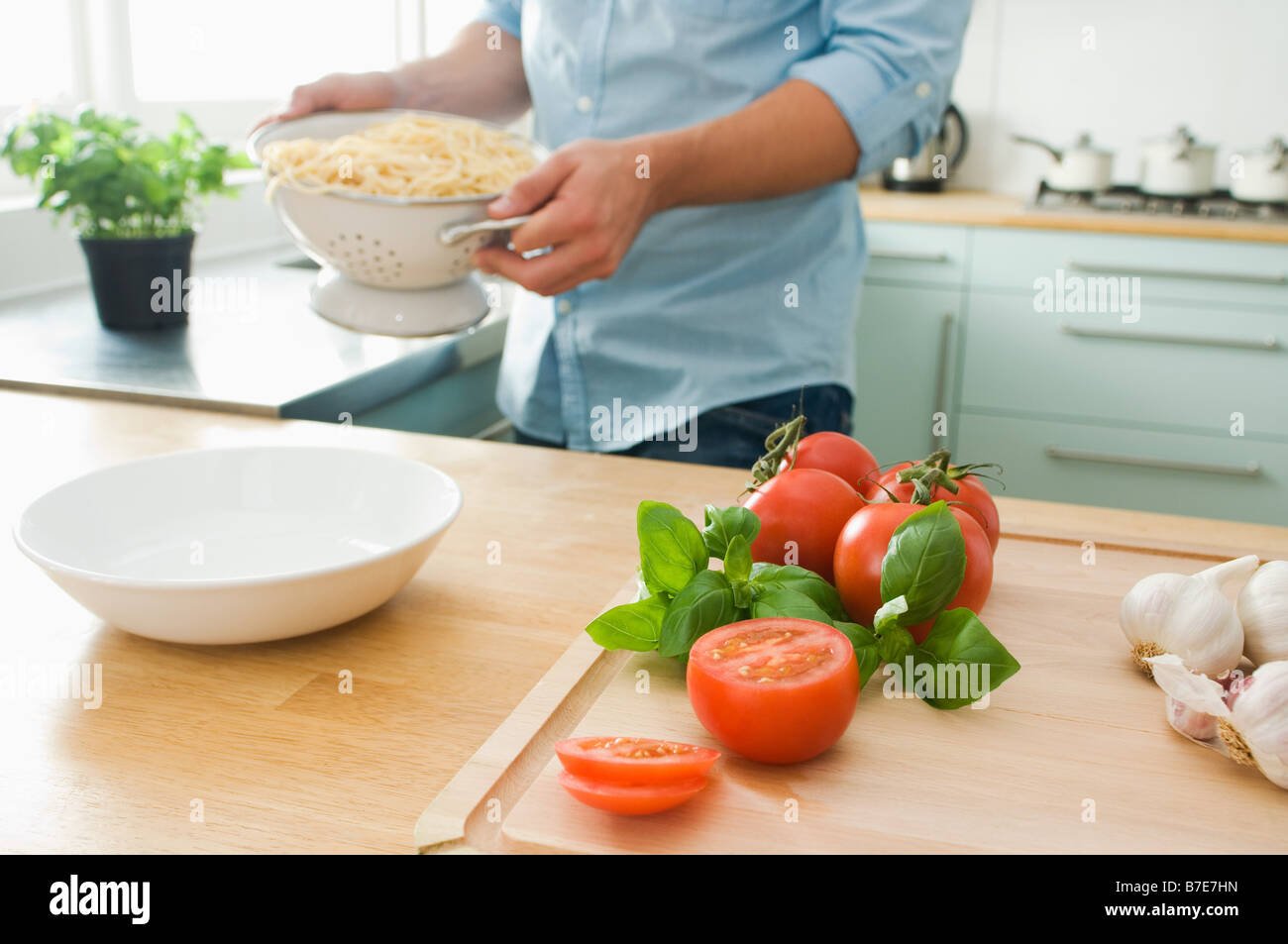 Man making meal Stock Photo - Alamy
