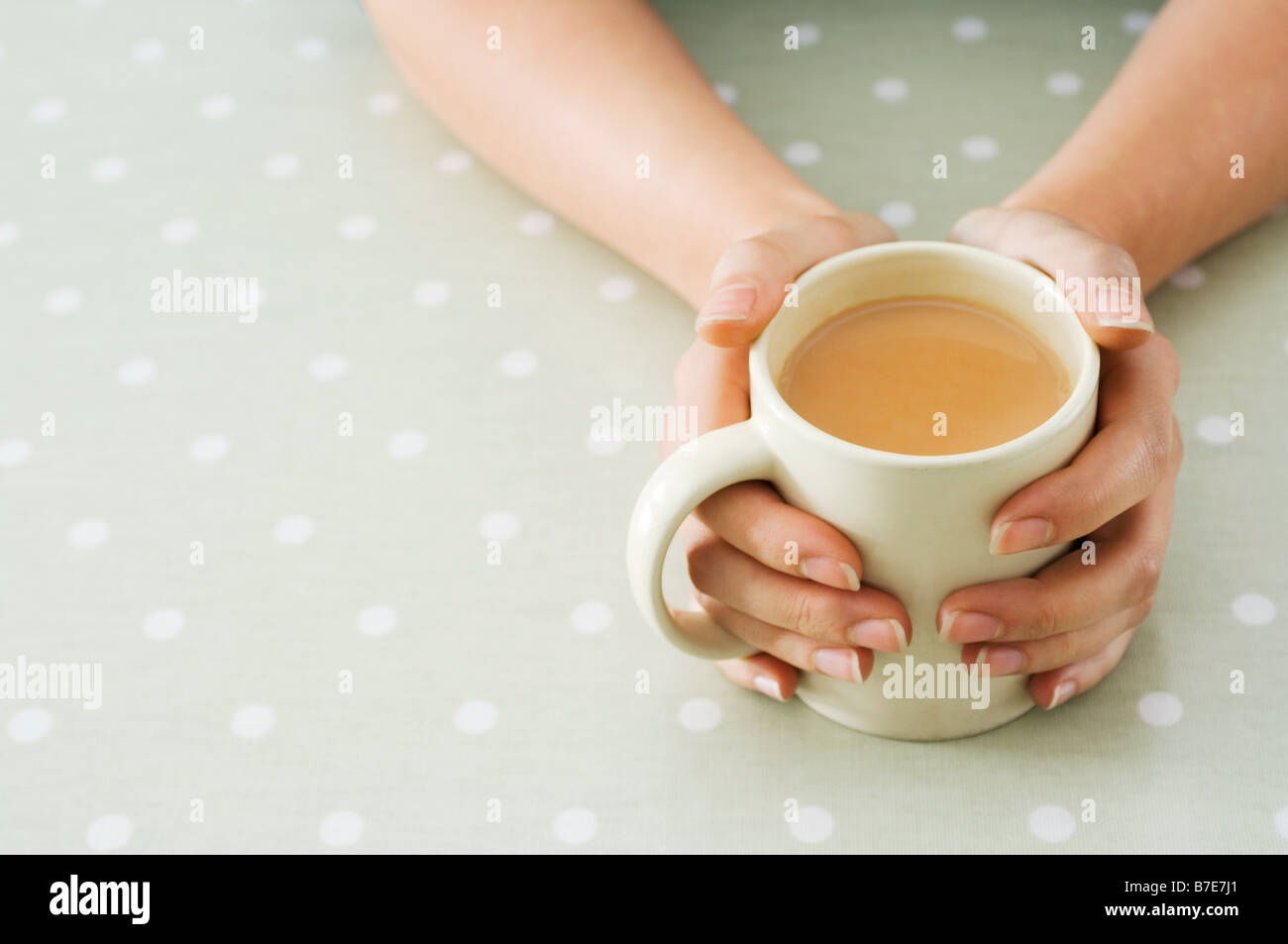 Person holding tea Stock Photo - Alamy