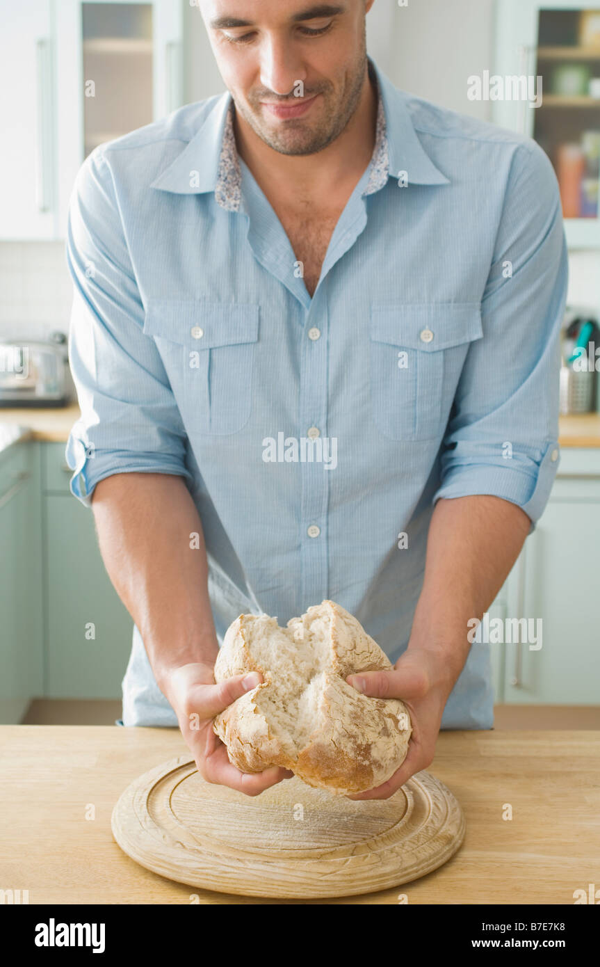 Man holding bread Stock Photo - Alamy